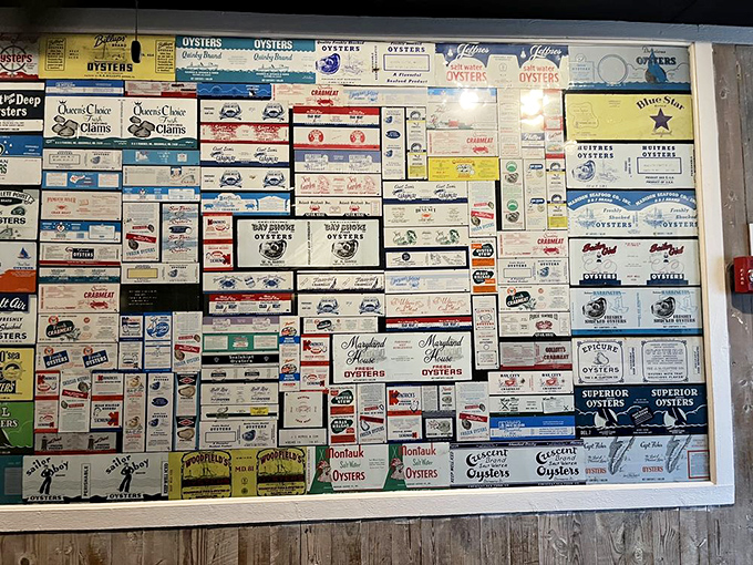 This wall of vintage oyster boxes isn't just decoration&mdash;it's a museum of Chesapeake Bay history, each label telling stories of watermen and their harvests.