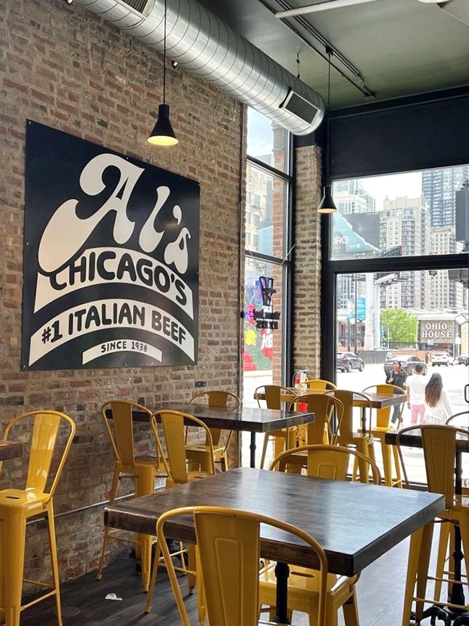 The interior showcases Al's signature style&mdash;exposed brick, that iconic logo, and yellow chairs ready to welcome hungry Chicagoans.