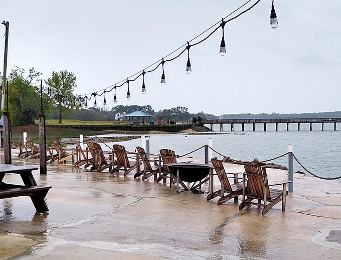 Adirondack chairs facing the water &ndash; nature's waiting room where time slows down and nobody minds the wait. 