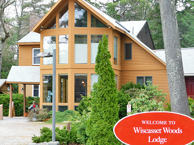 Wiscasset Woods Lodge blends rustic charm with modern comfort. Those floor-to-ceiling windows bring Maine's natural beauty right into your living space.