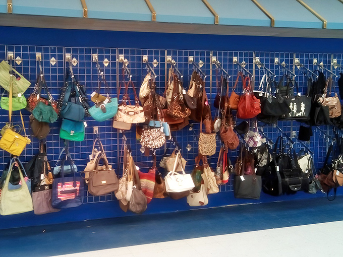 The handbag wall displays a rainbow of leather and vinyl possibilities&mdash;yesterday's arm candy waiting for today's fashionable embrace.