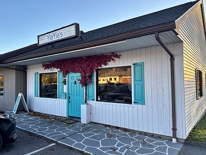 YiaYia's Greek Kitchen's charming exterior, with its turquoise accents and climbing flowers, promises Mediterranean flavors that transport you without passport fees.