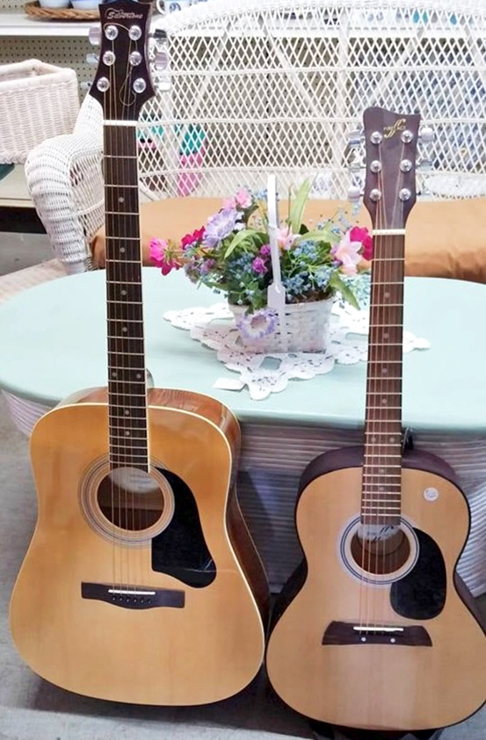 Two acoustic guitars having a quiet conversation about their next gig. Someone's musical journey is about to begin at a fraction of retail price.