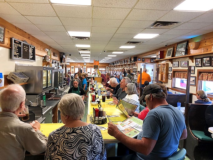 Every inch of wall space tells stories through photographs and memorabilia, creating a museum of Maine dining history you can actually eat in. 