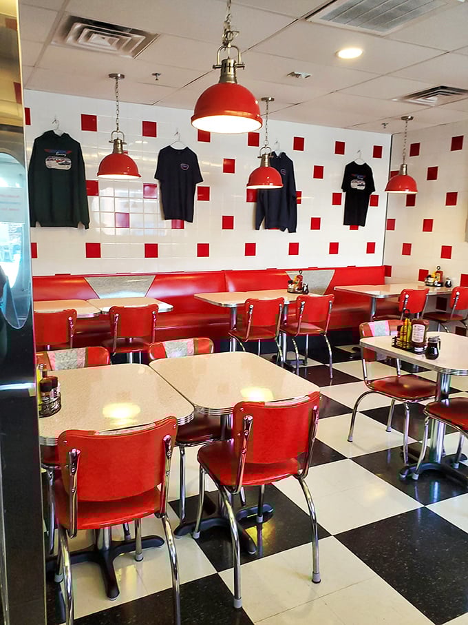 Red accents pop against clean white walls, creating visual energy that matches the enthusiasm emanating from satisfied diners.