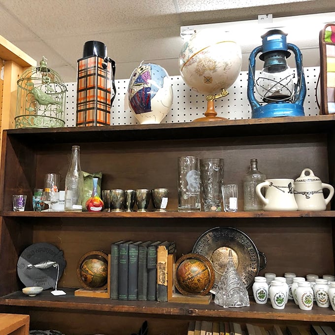 Antique lanterns and glassware catch the light, creating a magical display of functional vintage beauty.