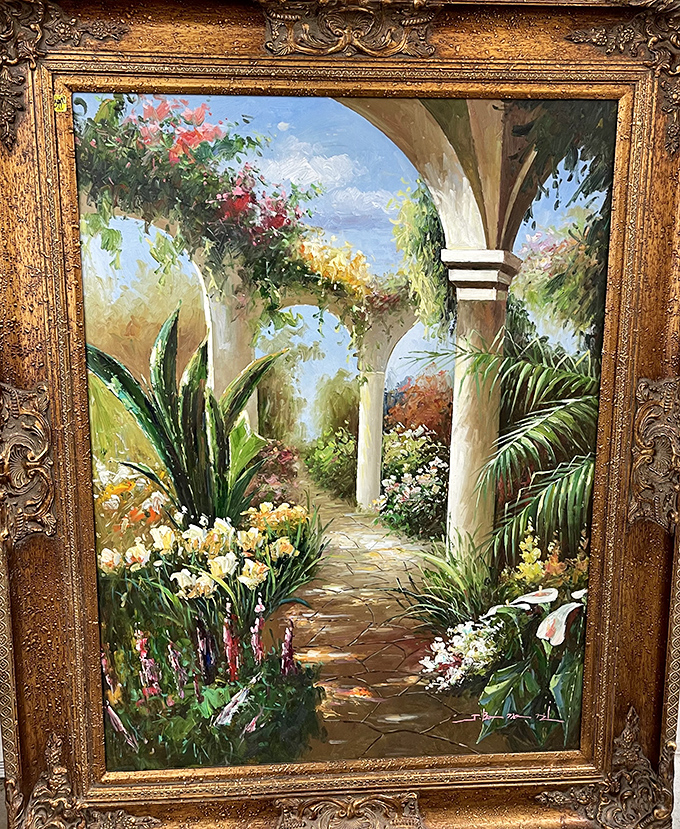 Gallery-worthy artwork at garage sale prices. This framed garden scene could transform a blank wall into your home's new focal point.
