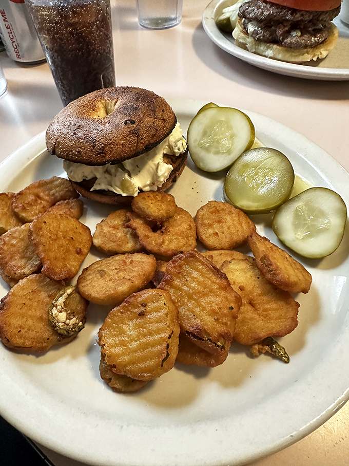 Bagel sandwich artistry at its finest. Crispy potatoes and pickles complete this lunch plate that puts sad desk salads to shame.