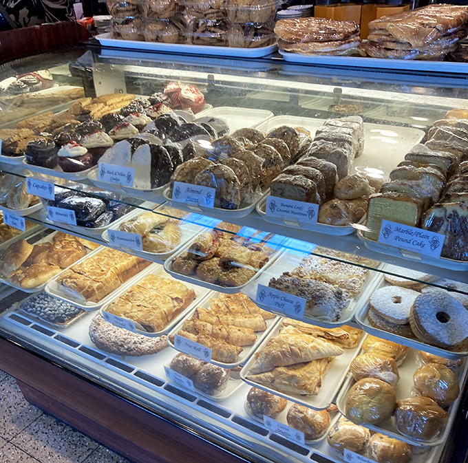 The dessert case &ndash; where willpower goes to die. A glass-enclosed gallery of baked masterpieces that makes "I'll just look" the biggest lie in dining.