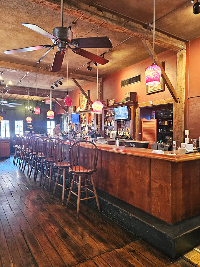 The bar area features exposed wooden beams and warm lighting that makes everyone feel like a regular, even on their first visit.