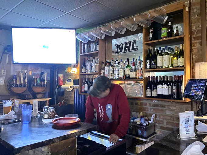 The bar: where solo diners find community and everyone debates Chicago sports between slices. That TV has seen some legendary games.
