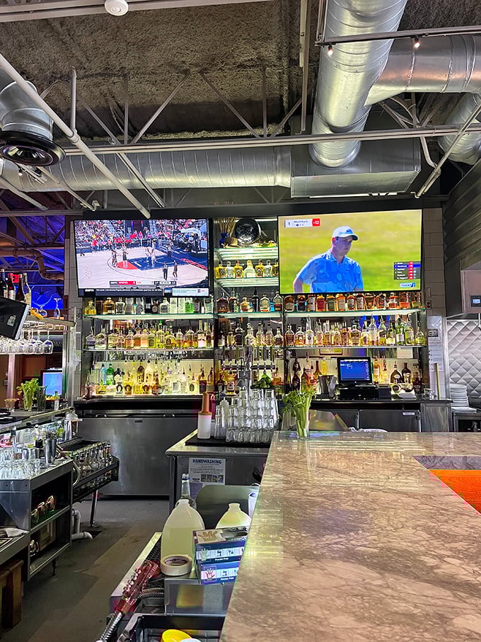 The bar&mdash;where bottles line up like soldiers ready to serve in the battle against ordinary evenings. Those TVs ensure you won't miss the game.