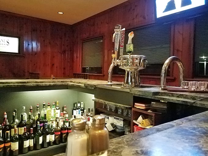 The bar area&mdash;where liquid courage meets culinary adventure. A well-stocked lineup promising good times and loosened belts.