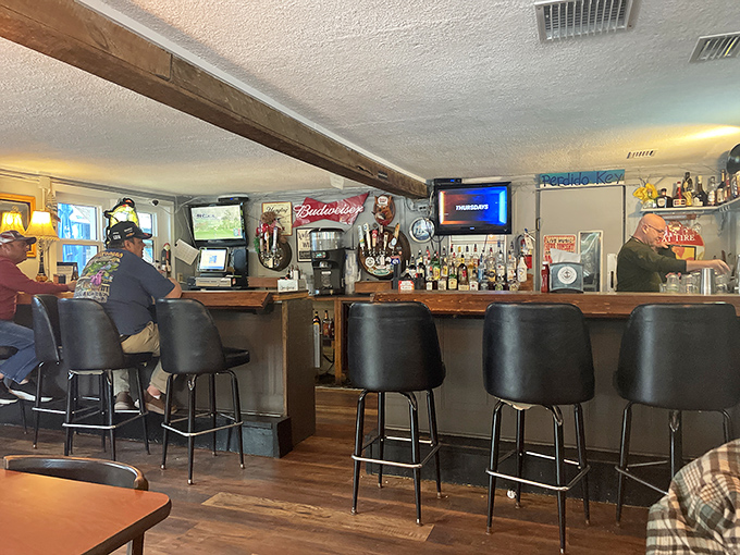 The bar area&mdash;where locals gather to debate important matters like football, fishing spots, and who makes the best key lime pie.