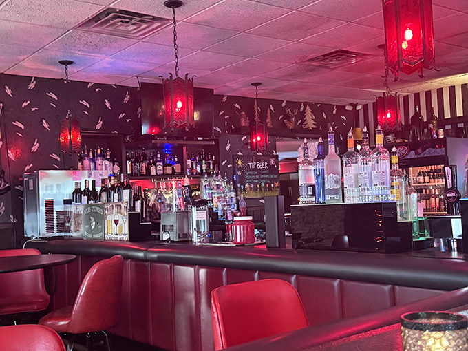 Red lighting bathes the bar in a glow that makes everyone look 10 years younger. No Instagram filter necessary here.