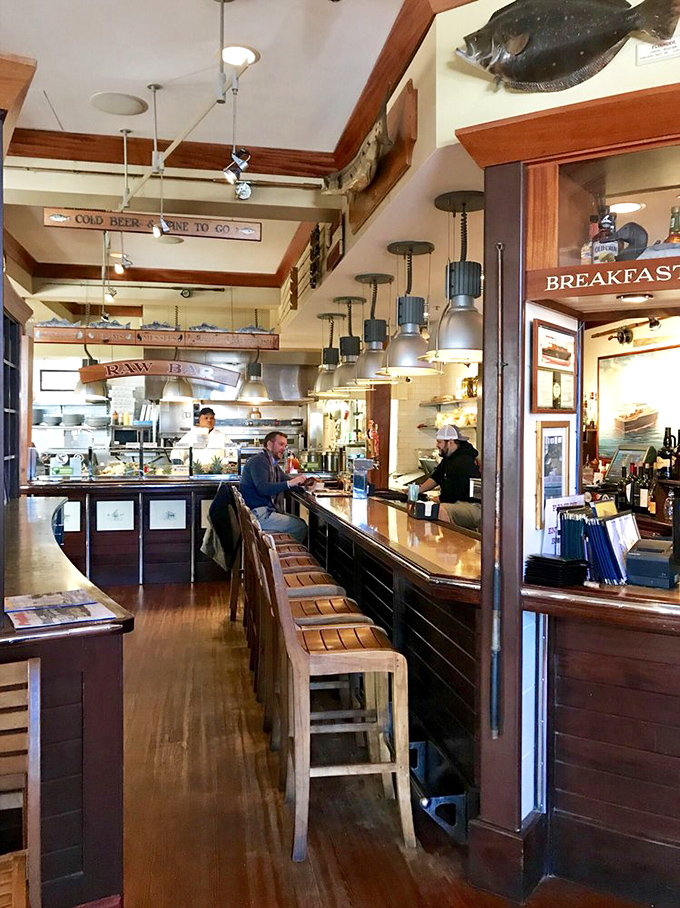 The bar where strangers become friends and friends become regulars. Notice the "Cold Beer Wine To Go" sign&mdash;they know what matters.