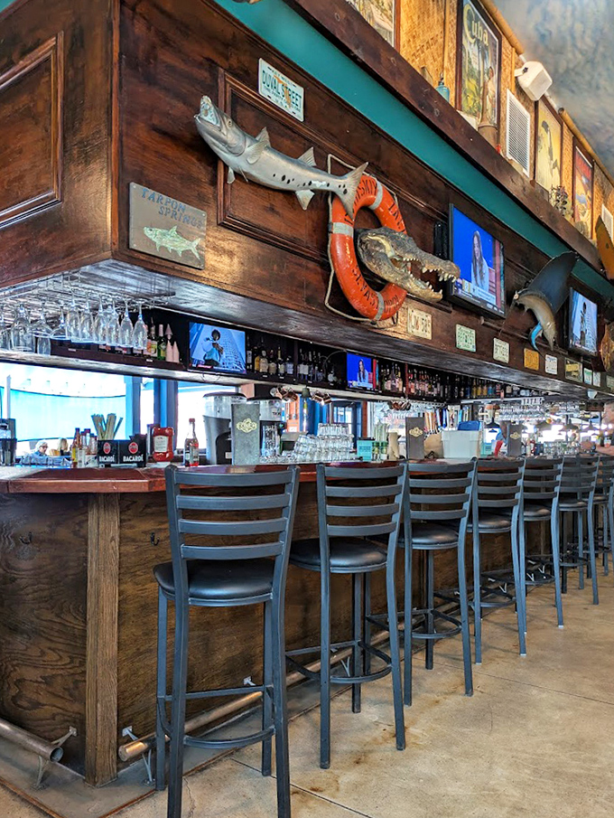 The bar area&mdash;where mounted fish keep watch over bottles, and stories flow as freely as the drinks beneath strings of twinkling lights.