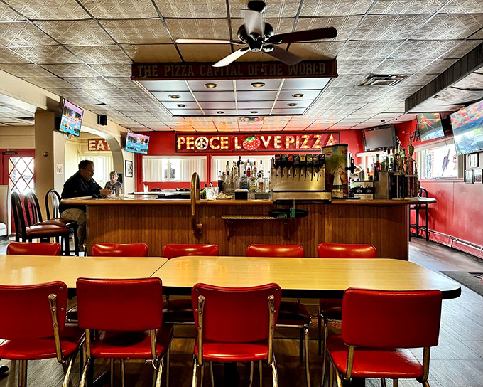 "Peace, Love, Pizza" isn't just a sign&mdash;it's the unofficial motto of a bar area where strangers become friends over cold drinks and hot trays.