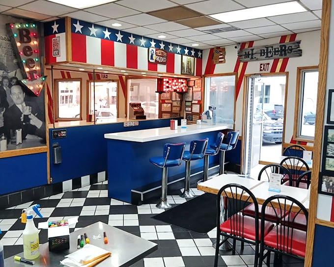 The counter service area&mdash;where coney magic happens. Those blue stools have supported generations of Detroiters in pursuit of perfection.
