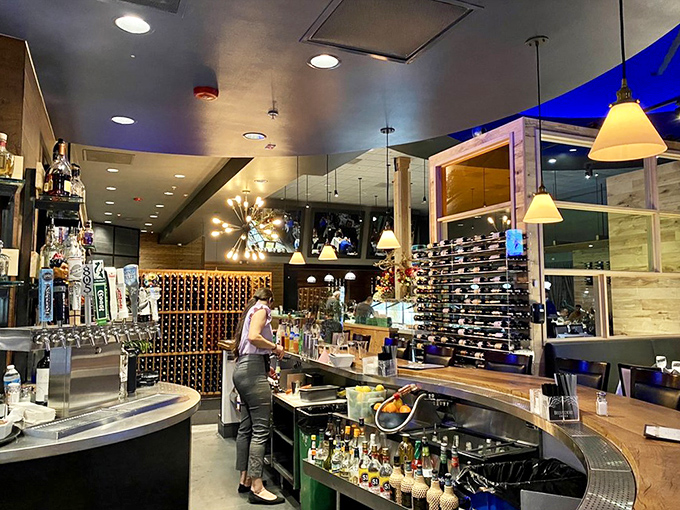 The bar doesn't just serve drinks&mdash;it's command central for an evening of strategic indulgence. Those wine bottles stand ready for your selection.