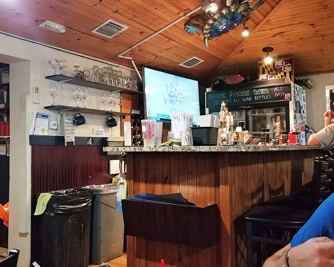 The rustic bar feels like it's witnessed decades of fishing tales, each one growing taller with every round ordered.