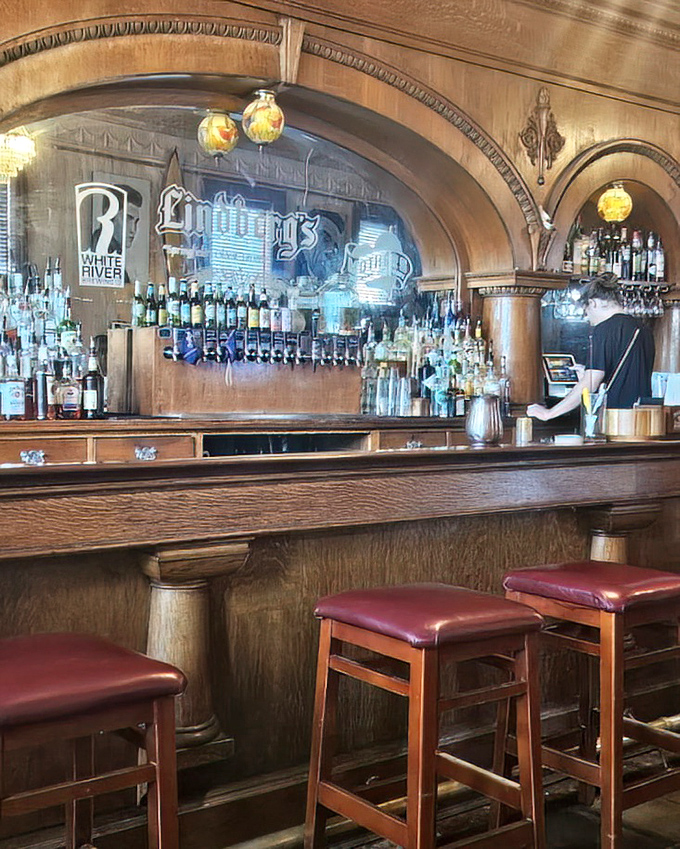 Behind this magnificent wooden bar, cocktails are crafted with the precision of a watchmaker and the soul of a poet.