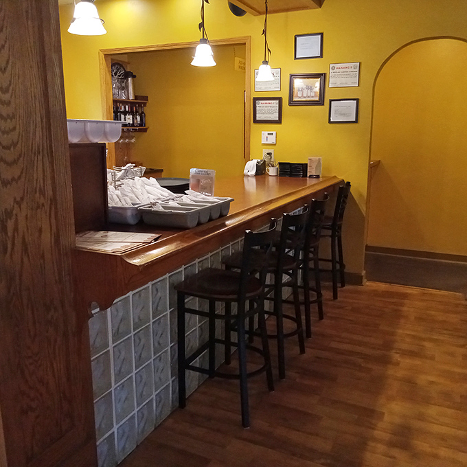 The bar area where strangers become friends over craft beers and shared plates&mdash;the Switzerland of restaurant territories where everyone's welcome.