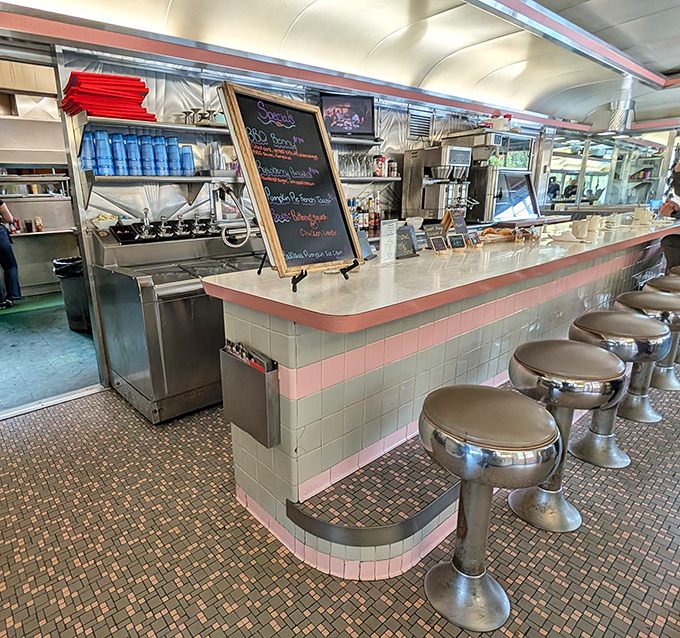 The counter&mdash;where solo diners find community, regulars have "their spot," and everyone gets a front-row view of short-order wizardry.