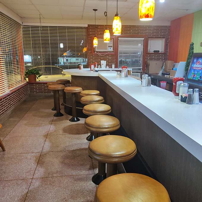 The counter seating &ndash; where solo diners become temporary members of the breakfast club and coffee refills arrive before you realize you need one.