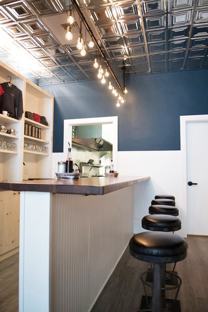 The counter where breakfast dreams come true. Those stools have witnessed more morning epiphanies than a self-help guru's entire career.