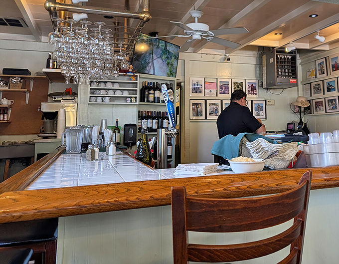 The bar area&mdash;where wine glasses hang like crystal stalactites and stories flow as freely as the California wines being poured.