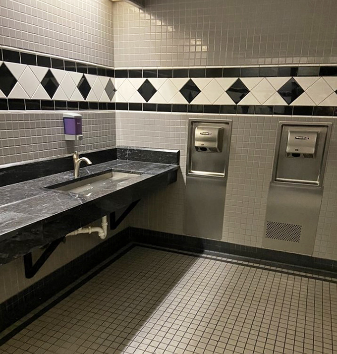 Even the restrooms at Whitey's show attention to detail with classic black and white tile work that nods to traditional American diners.
