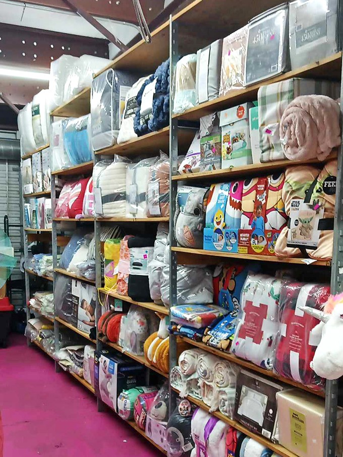 Bedding bonanza! From practical pillows to whimsical character comforters, this aisle promises sweeter dreams at flea market prices.