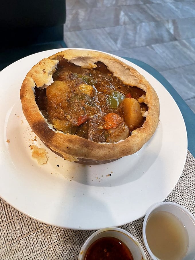 This beef stew nestled in bread transforms humble ingredients into something approaching pure culinary poetry magic. 