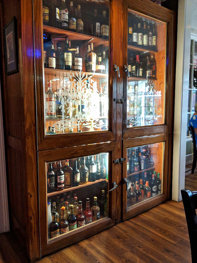 Behind these wooden doors lies liquid happiness &ndash; a carefully curated collection of spirits that promises the perfect pairing for your meal.