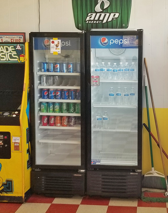 The beverage coolers stand ready like loyal soldiers, prepared to extinguish the fire of sport peppers with ice-cold refreshment.