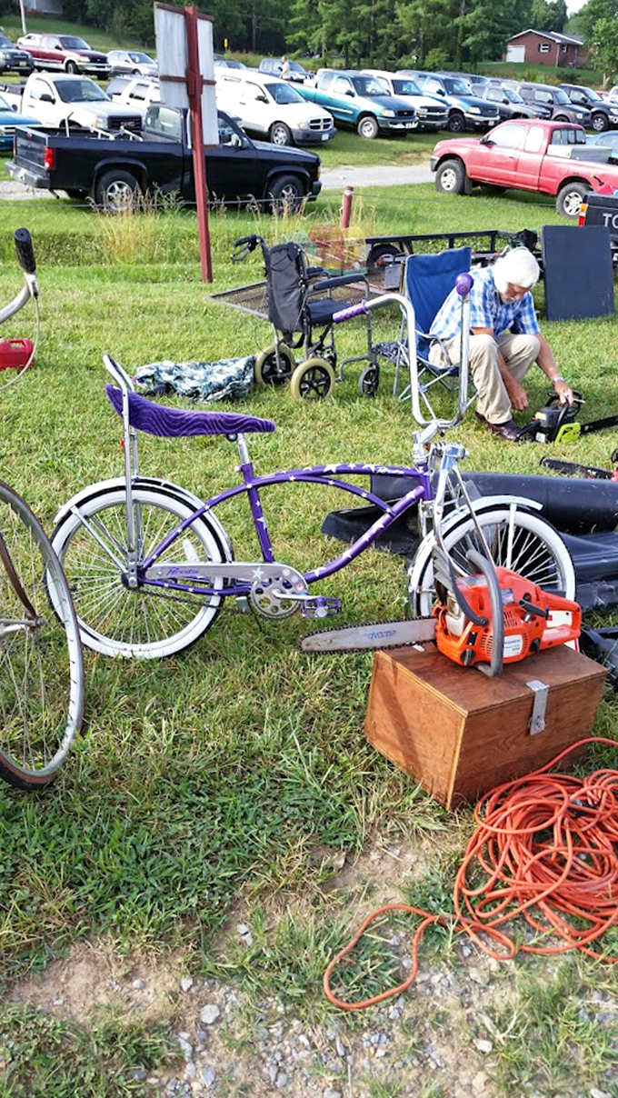Wheels of fortune! This vintage bicycle sits patiently beside modern power tools&mdash;the perfect metaphor for the flea market's timeless appeal.