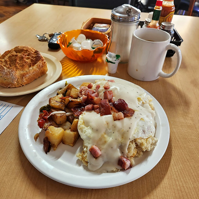Biscuits and gravy that could settle family feuds. That gravy isn't just poured – it's lovingly blanketed over everything like fresh snow.