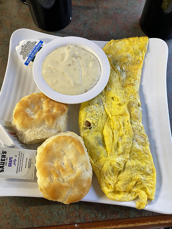 Biscuits so fluffy they could float away if not anchored by that perfect pool of sausage gravy. The omelet's just showing off.