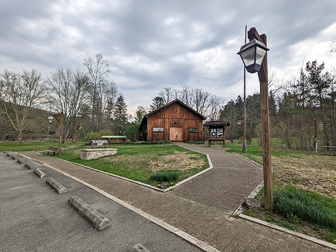 Industrial heritage preserved in rustic wood. The blacksmith shop stands as a humble reminder of the hands that once shaped hot iron in this now-peaceful valley.