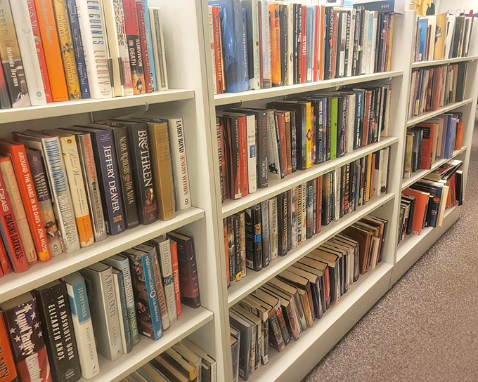 Bookworm paradise where bestsellers of yesteryear wait patiently for new readers. That cookbook might contain someone's handwritten secret recipe.