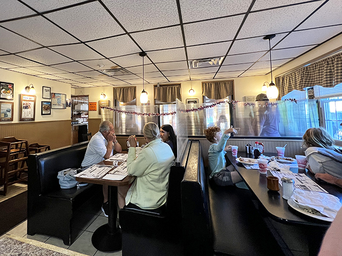 The booth section &ndash; where locals and travelers alike slide into vinyl seats to solve the world's problems over coffee and pie.