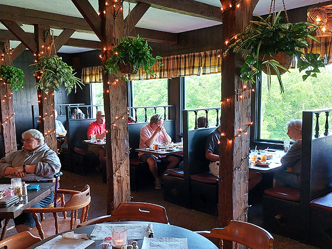 Exposed beams, hanging plants, and booth seating create the perfect backdrop for conversations that linger long after the plates are cleared.