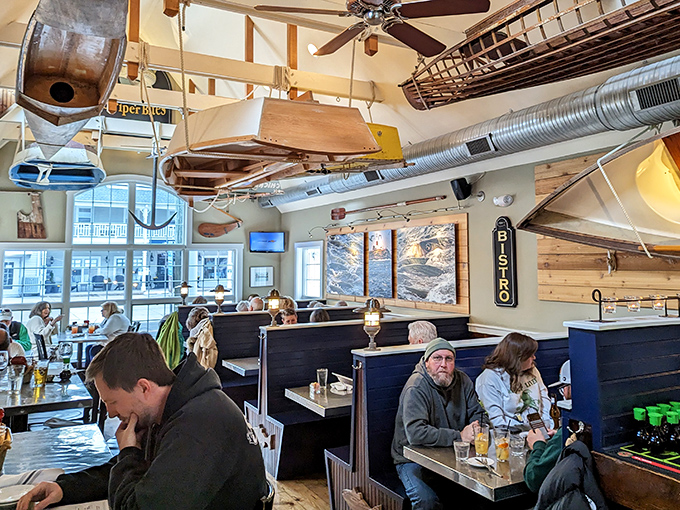 Cozy booths where seafood dreams come true. That wooden boat overhead isn't just watching you eat&mdash;it's silently judging your seafood ordering skills.