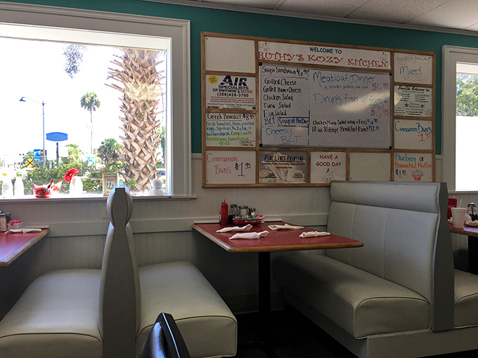 Booth seating with a view of the daily specials board&mdash;a front-row seat to the possibilities that await your taste buds.