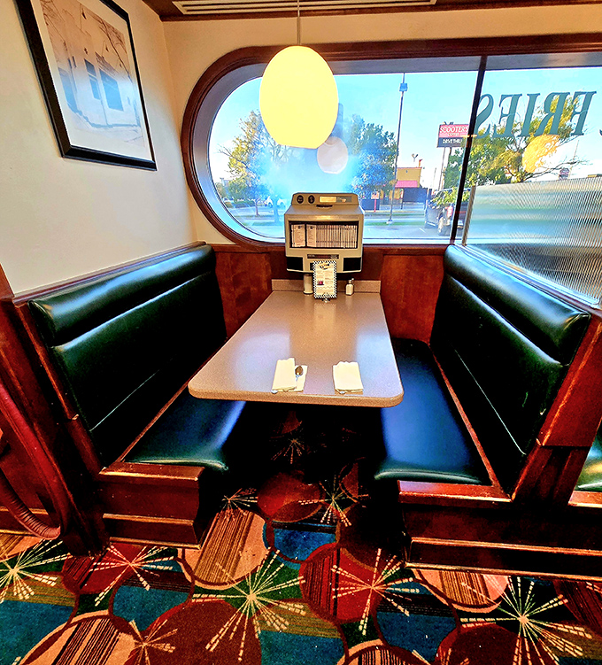 These booths aren't just seats, they're front-row tickets to the greatest show on earth: American diner culture in full swing.