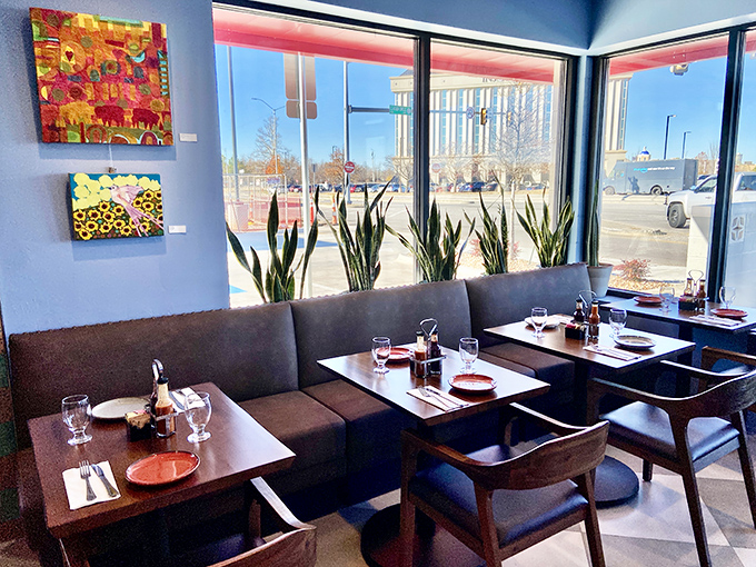 Modern yet cozy, these window booths offer front-row seats to both Classen Boulevard's rhythm and the restaurant's inner warmth.