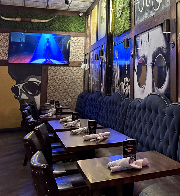 Rock-star portraits watch over diners in this moody blue booth section. Even the walls seem to know you're about to have a memorable meal.
