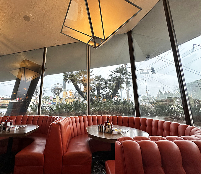 The circular booth&mdash;diner royalty seating. Like sitting in a mid-century modern throne where pancakes replace scepters and crowns.