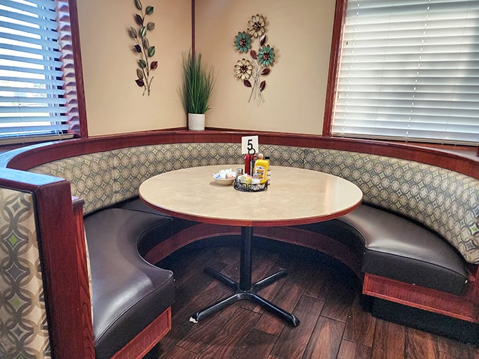 The curved booth isn't just seating&mdash;it's a semicircle of comfort that hugs you while you hug your coffee cup. Breakfast in the round.